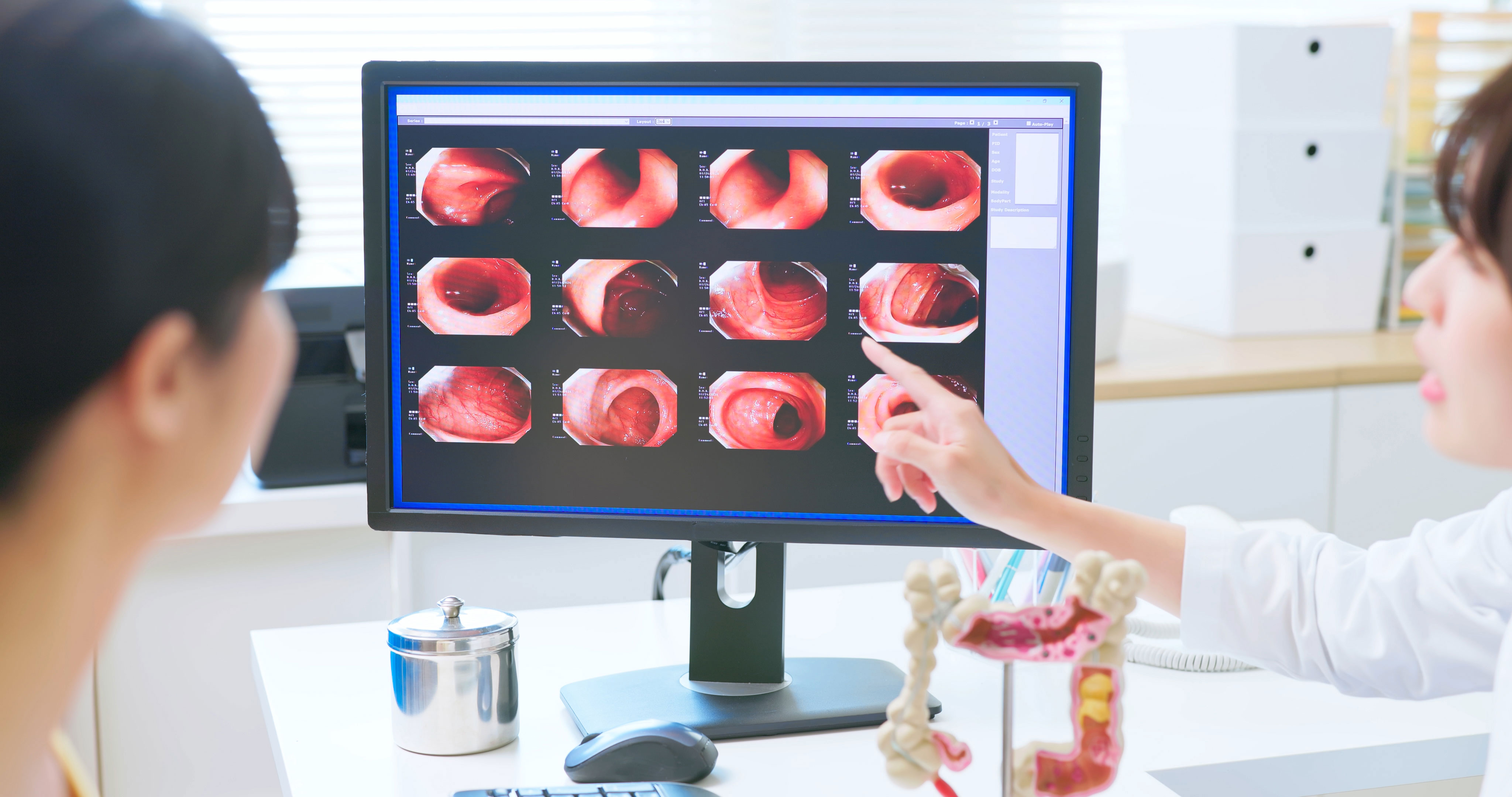 Doctor and patient looking at colonoscopy results