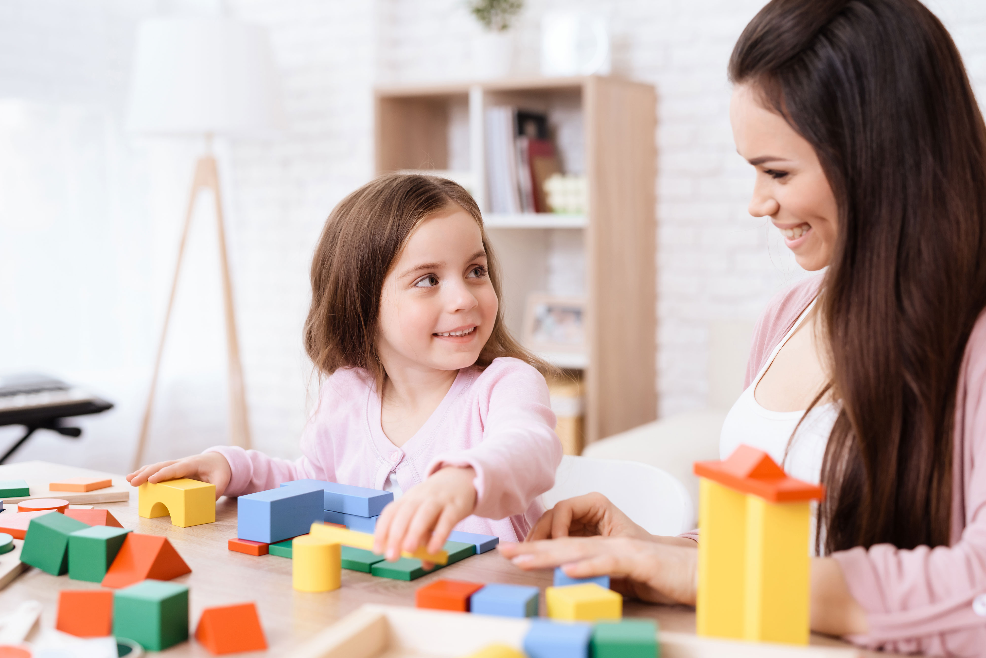 Mom and child playing with blocks